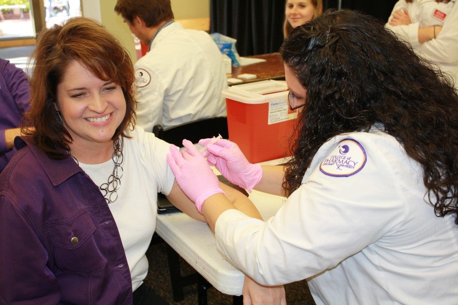 Pharmacy students give out 100,000th flu shot during American ...